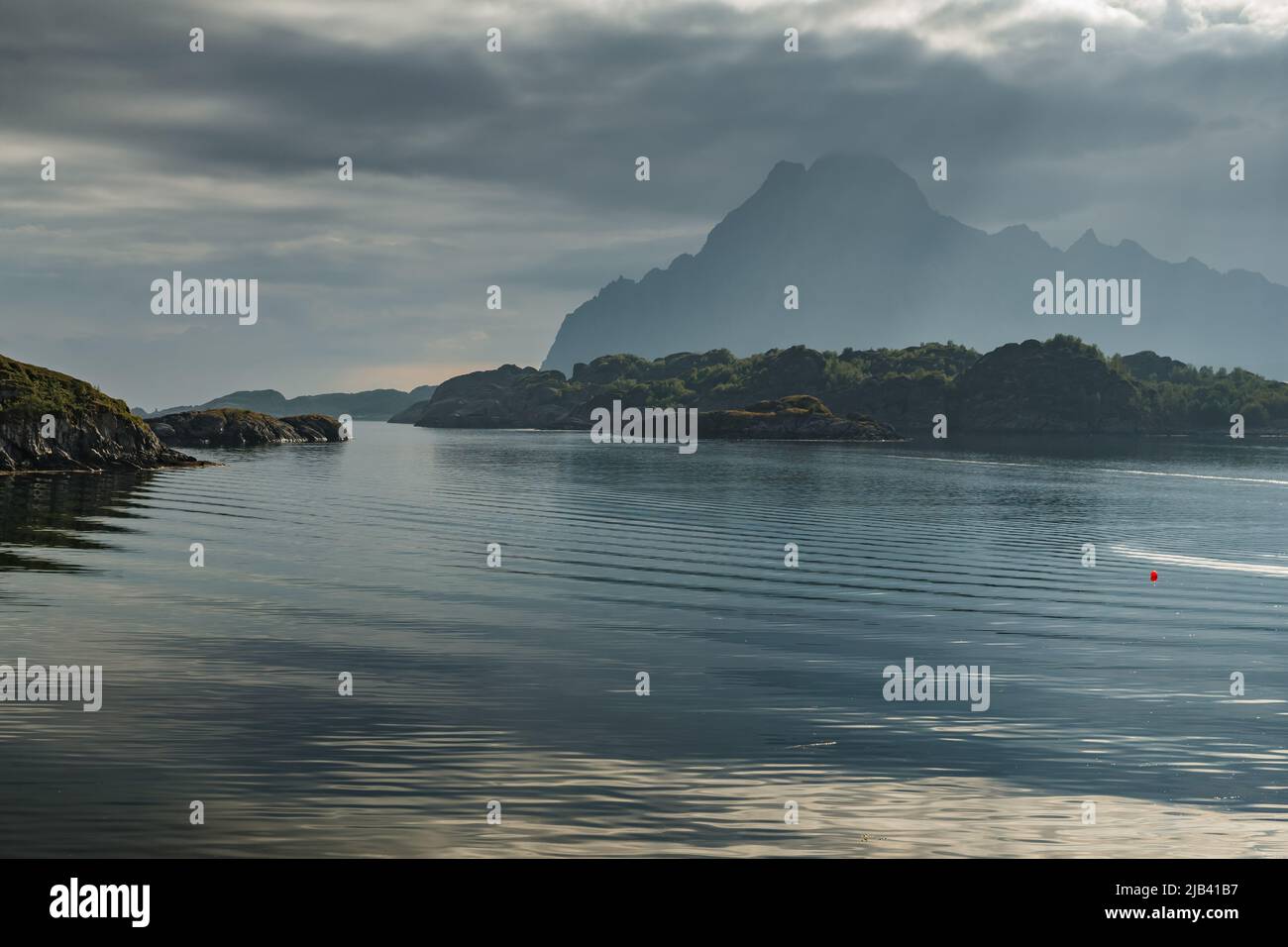 Norwegian seascape, rocky coast with dramatic skies, the sun breaks ...