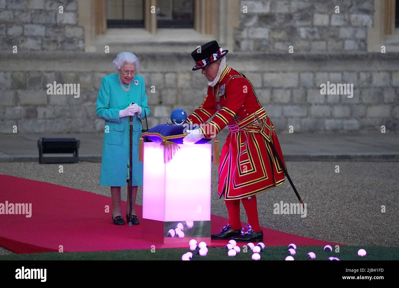 Queen Elizabeth II arrives to symbolically lead the lighting of the ...