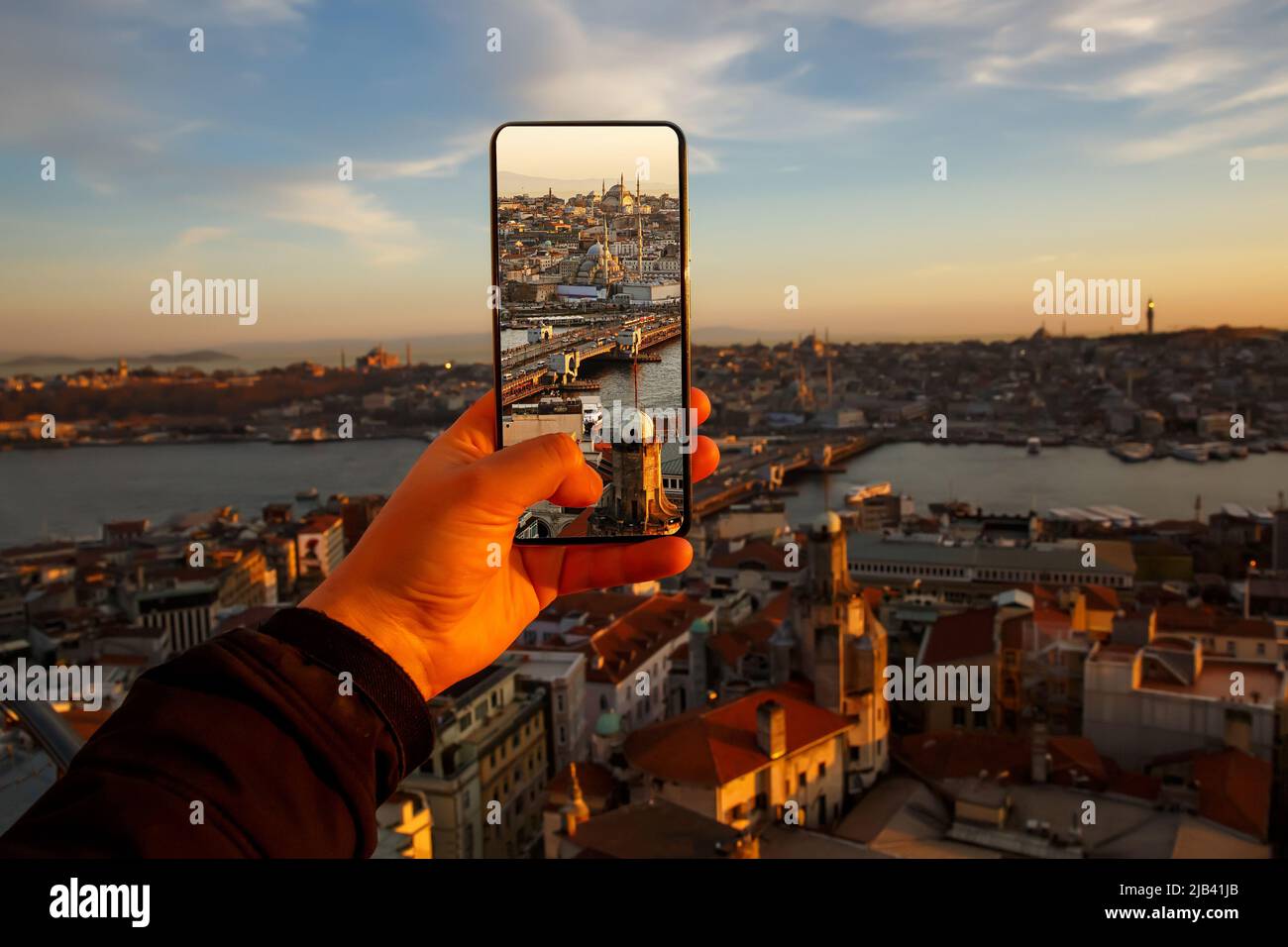 Taking photos and video of sunset Istanbul landscape via smartphone ...