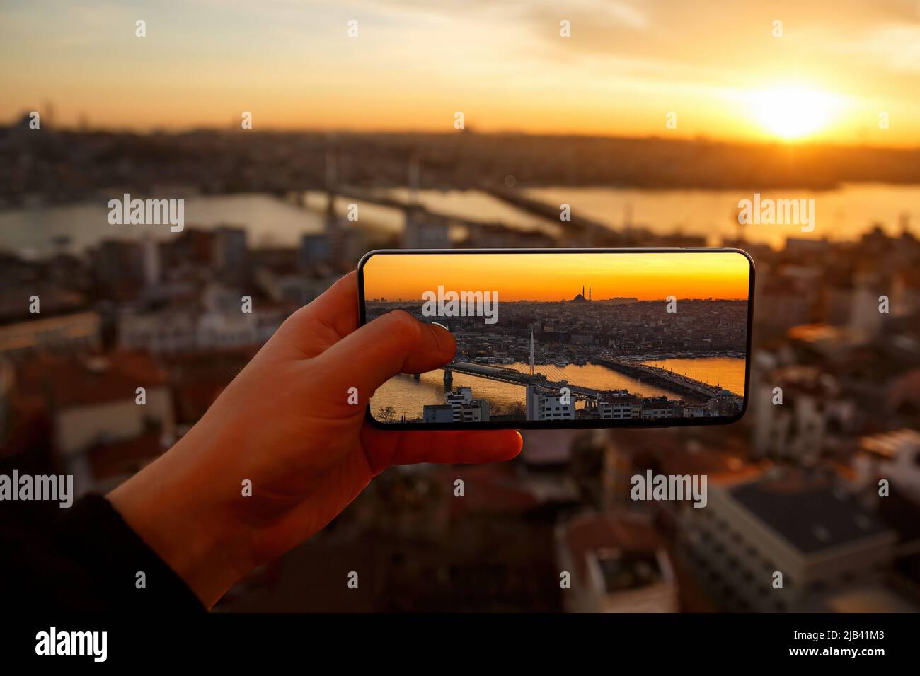 Taking photos and video of sunset Istanbul landscape via smartphone ...