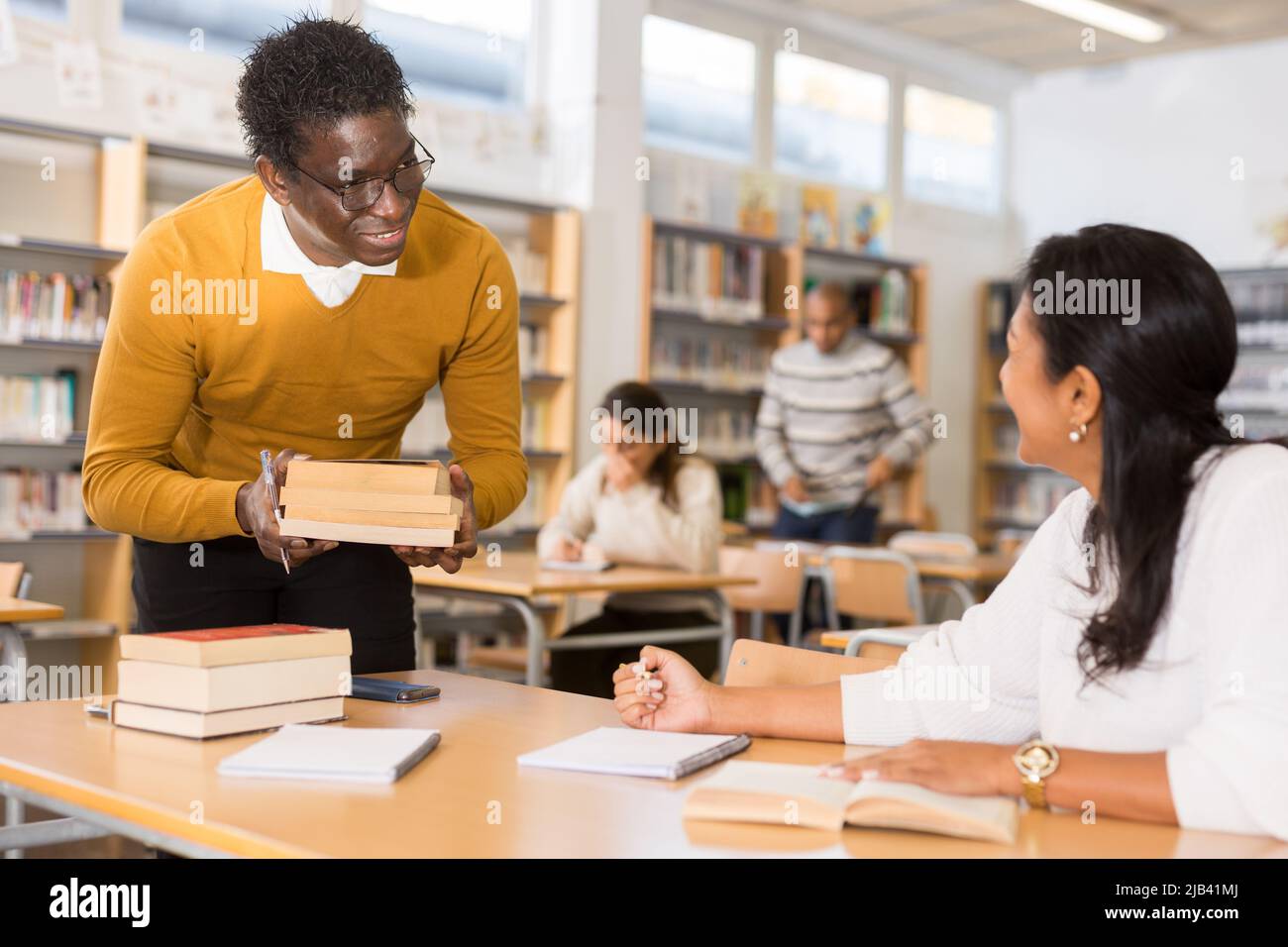 Male librarian book hi-res stock photography and images - Alamy