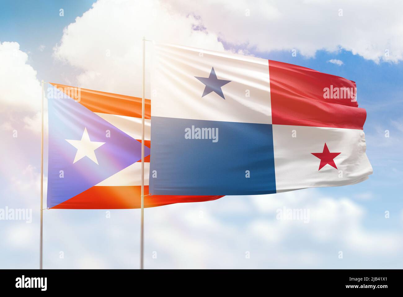 Sunny blue sky and flags of panama and puerto rico Stock Photo - Alamy