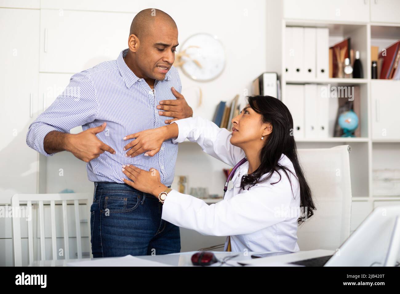 Patient in examination by doctor in clinic Stock Photo - Alamy