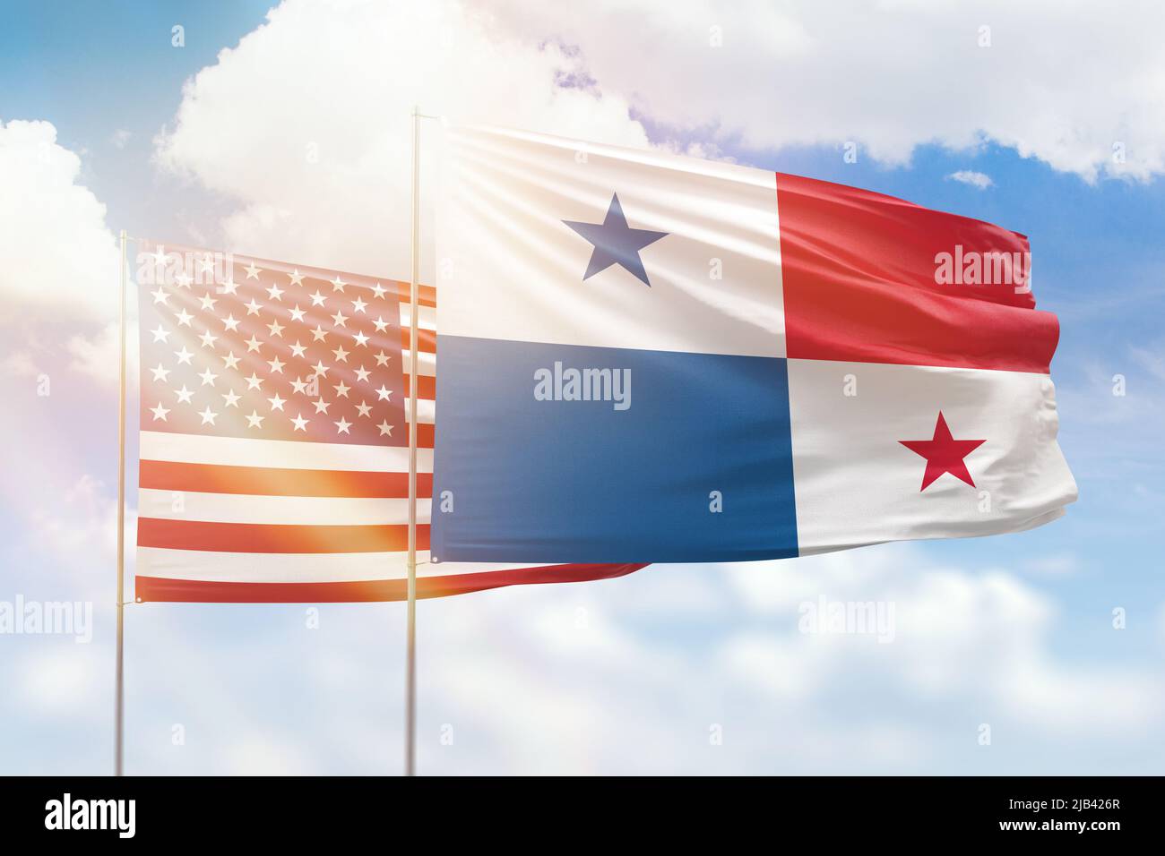 Sunny blue sky and flags of panama and usa Stock Photo - Alamy