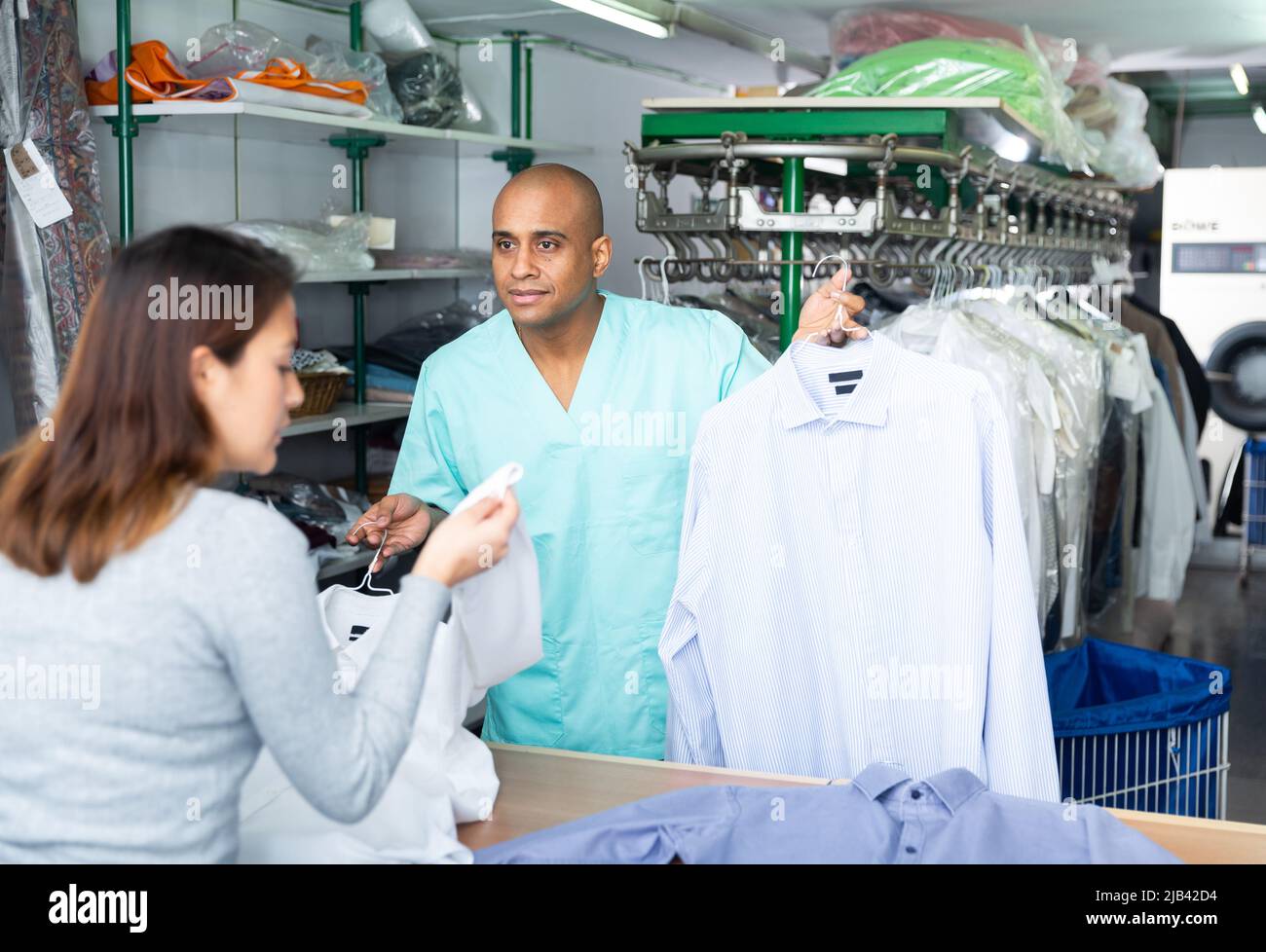 Laundry employee hi-res stock photography and images - Alamy