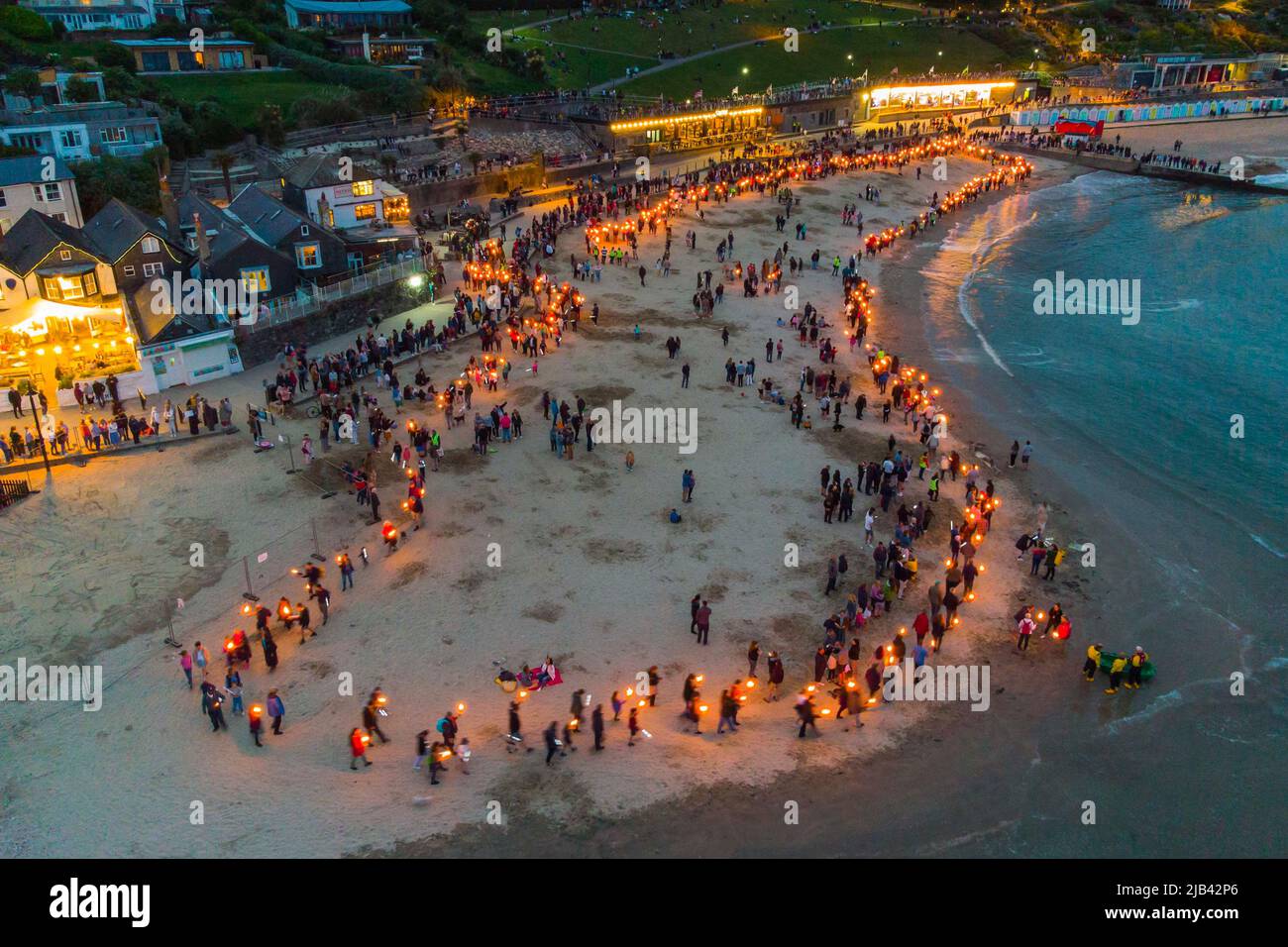Lyme Regis, Dorset, UK. 2nd June 2022. Torchlight parade and beacon ...