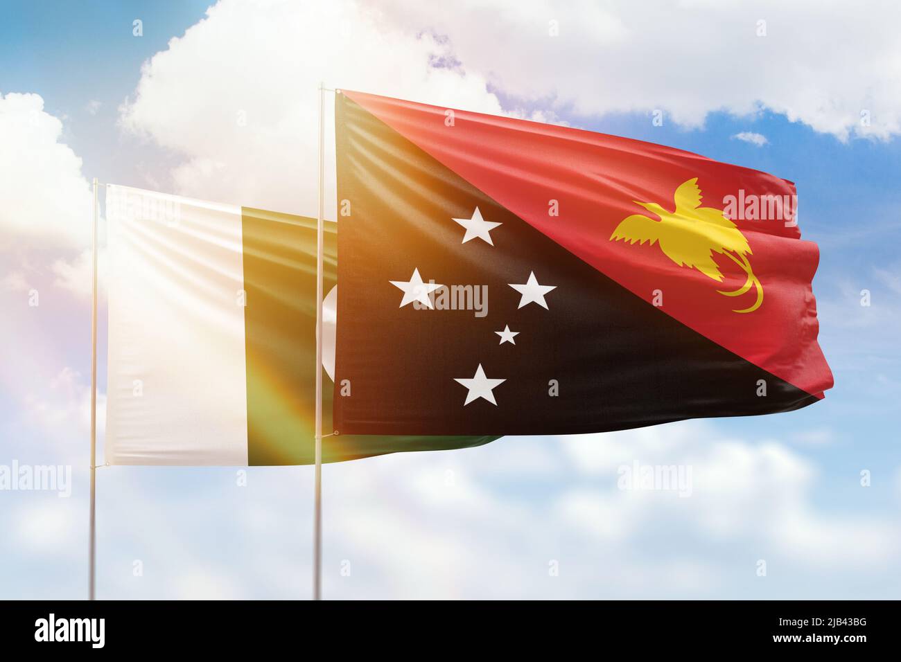 Sunny blue sky and flags of papua new guinea and pakistan Stock Photo ...