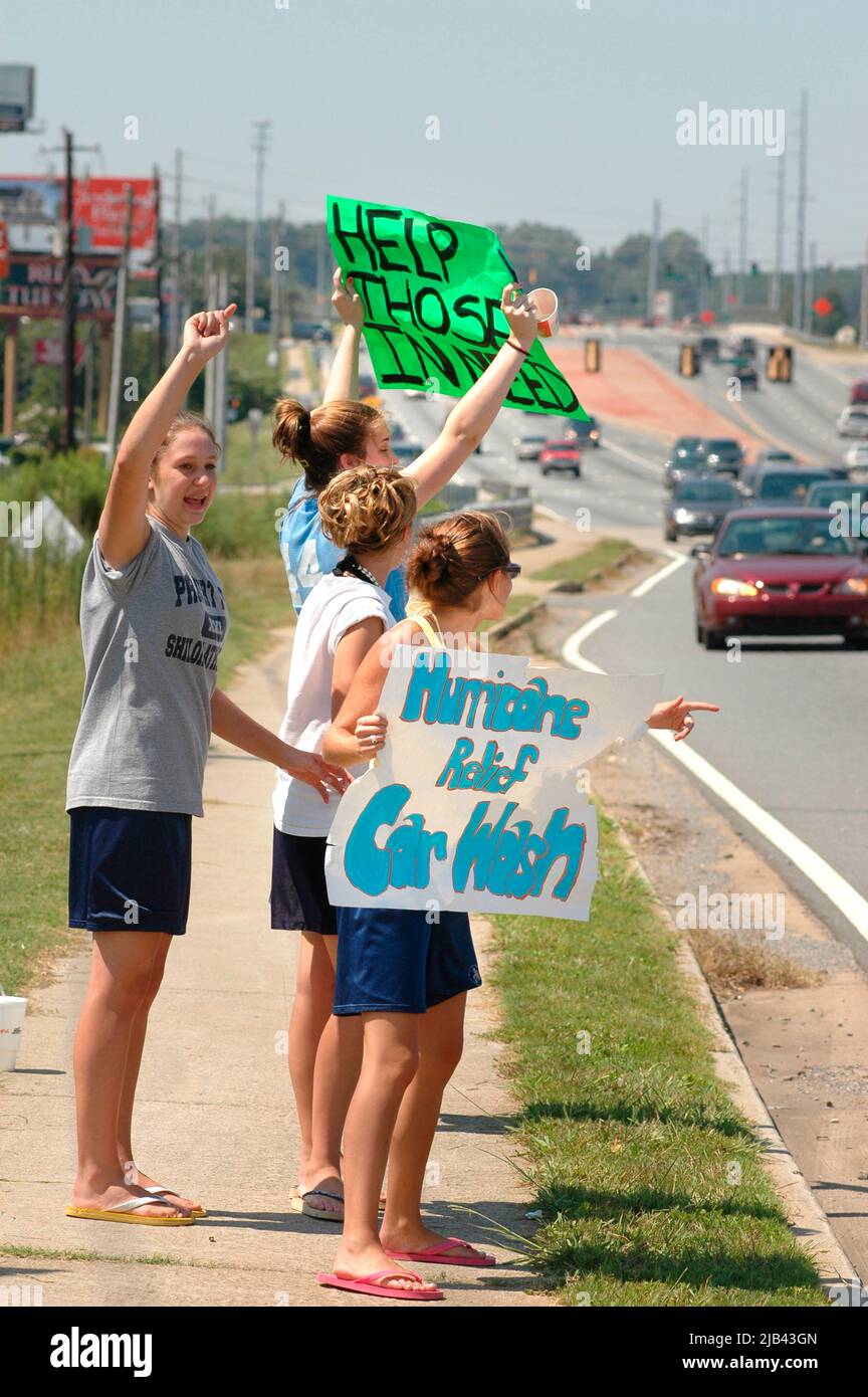Teen age church group has a donation car wash to help victims of ...