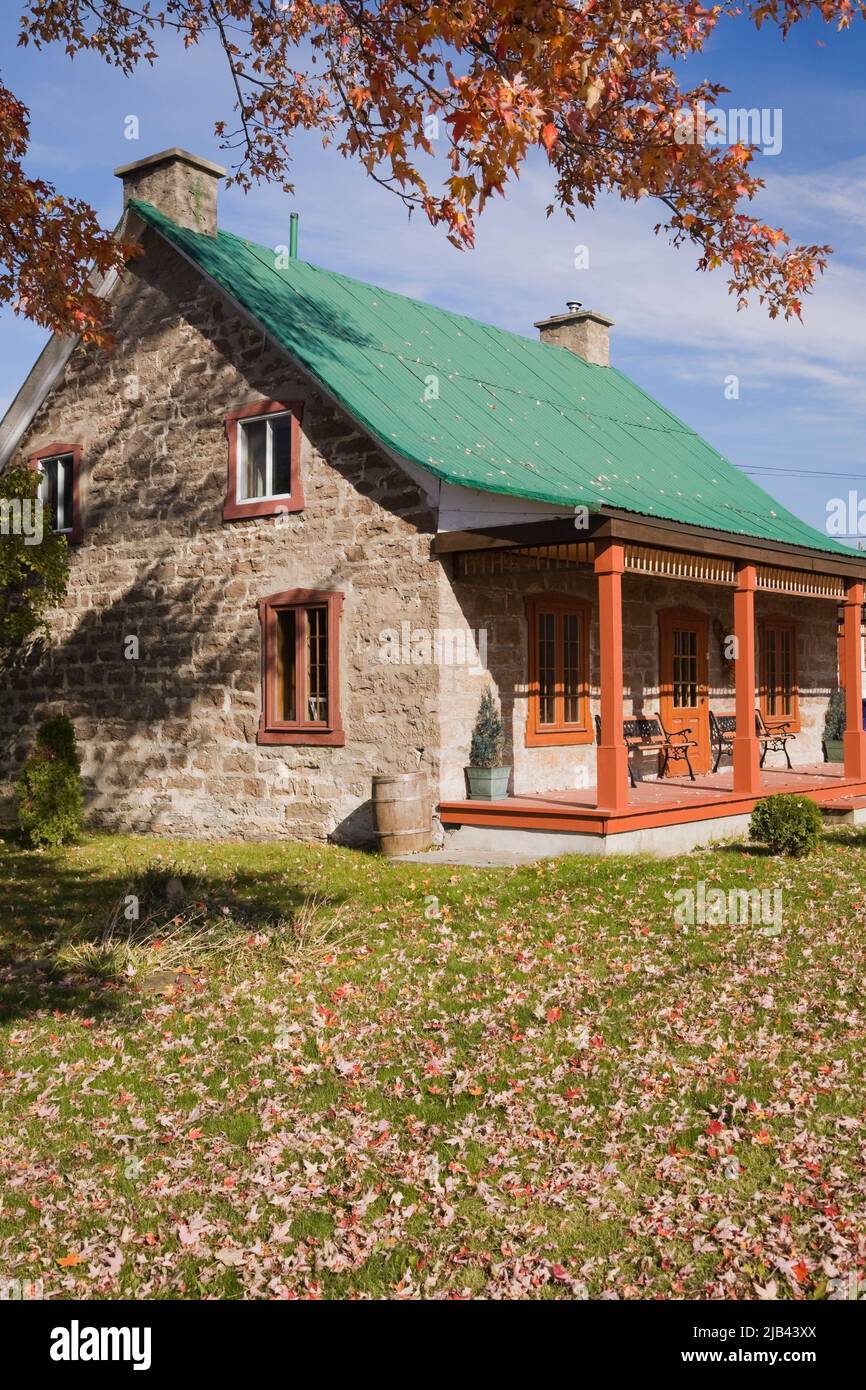 Old circa 1850 Canadiana cottage style cut stone home with green sheet ...