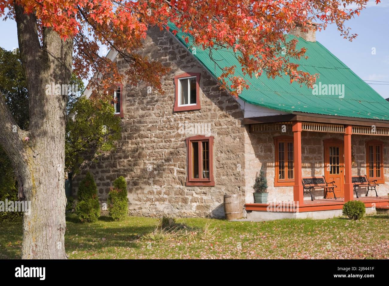 Old circa 1850 Canadiana cottage style cut stone home with green sheet ...