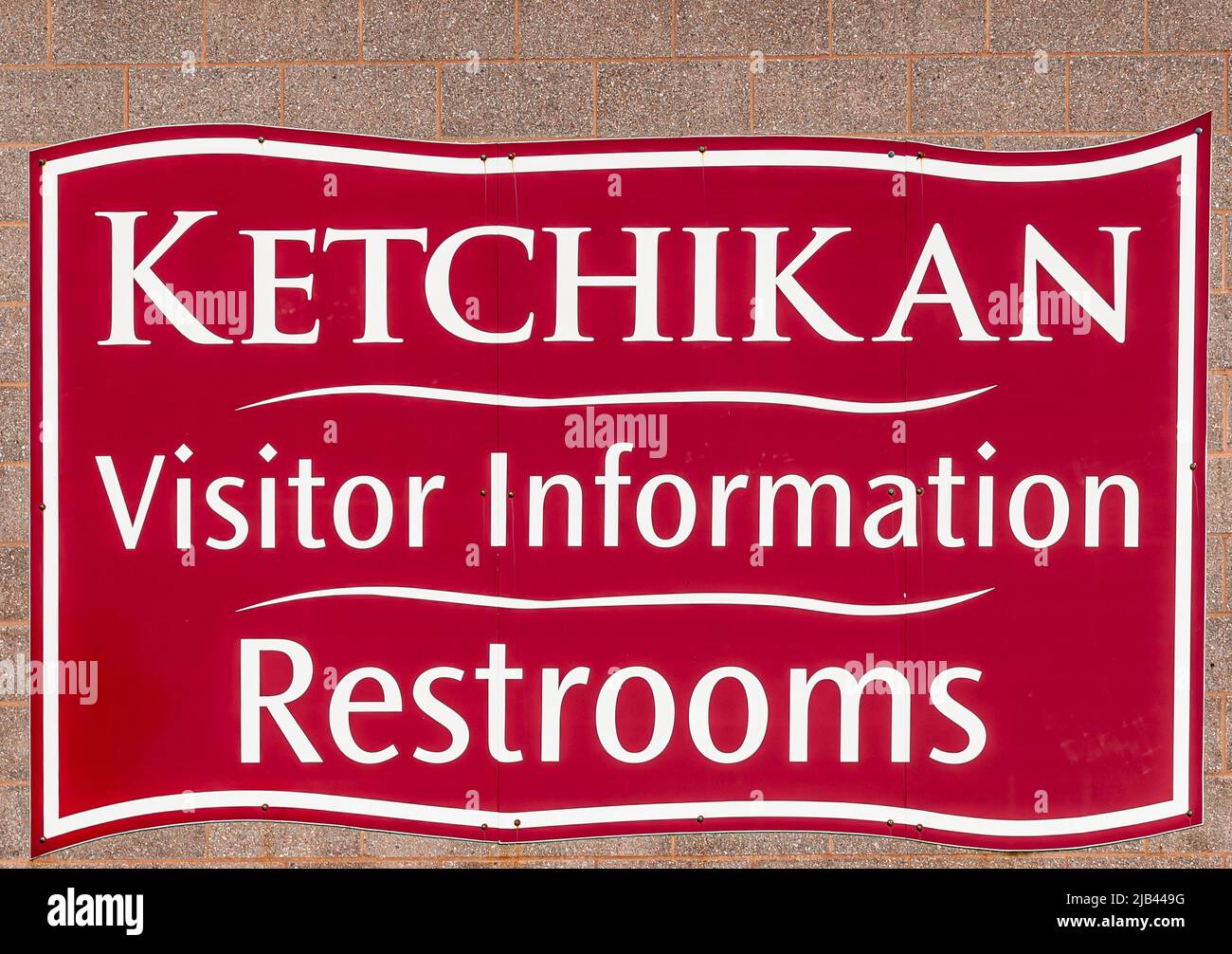 Ketchikan, Alaska, USA - July 17, 2011: Closeup of white on red town ...