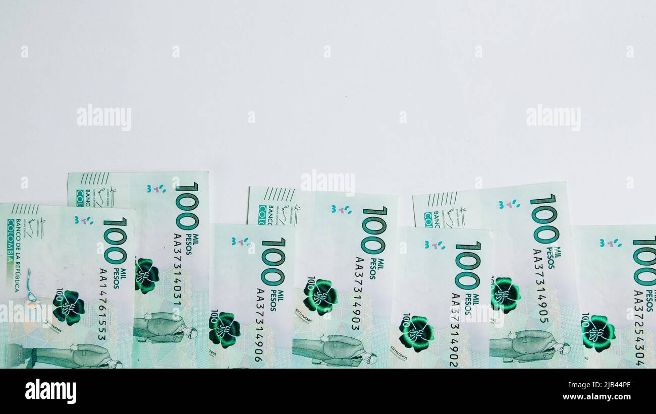 colombian money, one hundred thousand pesos on white background Stock ...