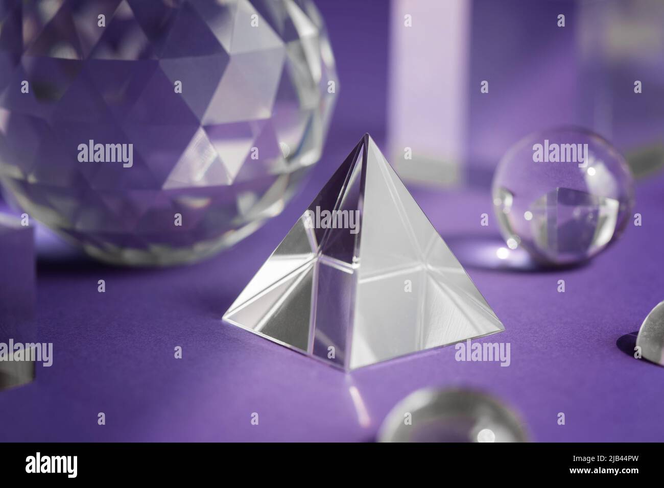 Crystal prism refracting light, magic crystals and pyramid, sphere and ...