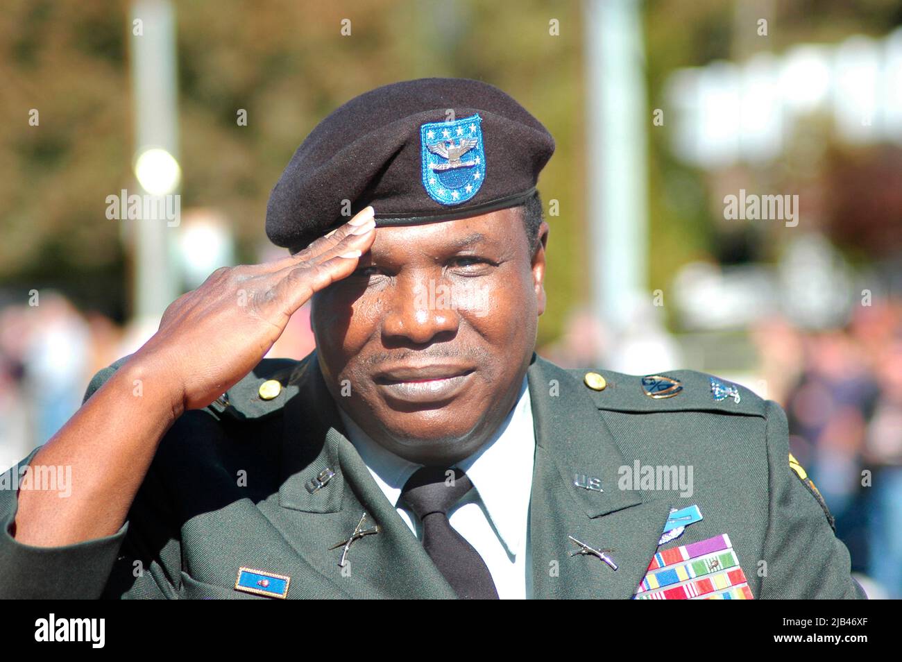 Black adult Colonel salutes at camera Stock Photo - Alamy