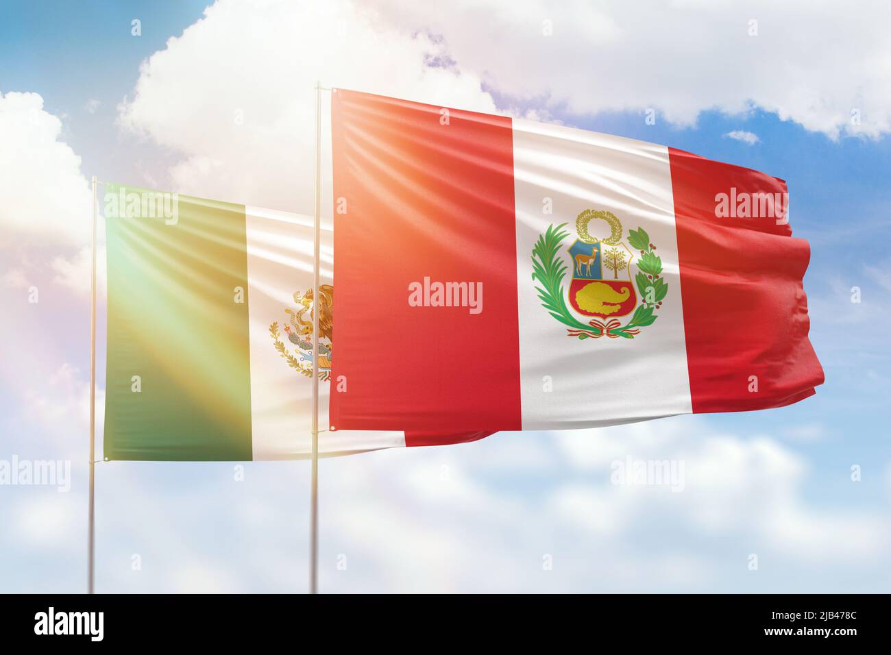 Sunny blue sky and flags of peru and mexico Stock Photo - Alamy