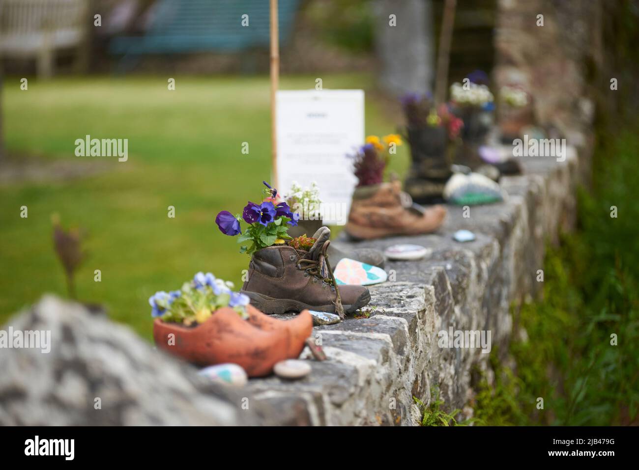 Bickington, Devon, UK. 2nd June 2022. Flowerpots line the Village Hall ...