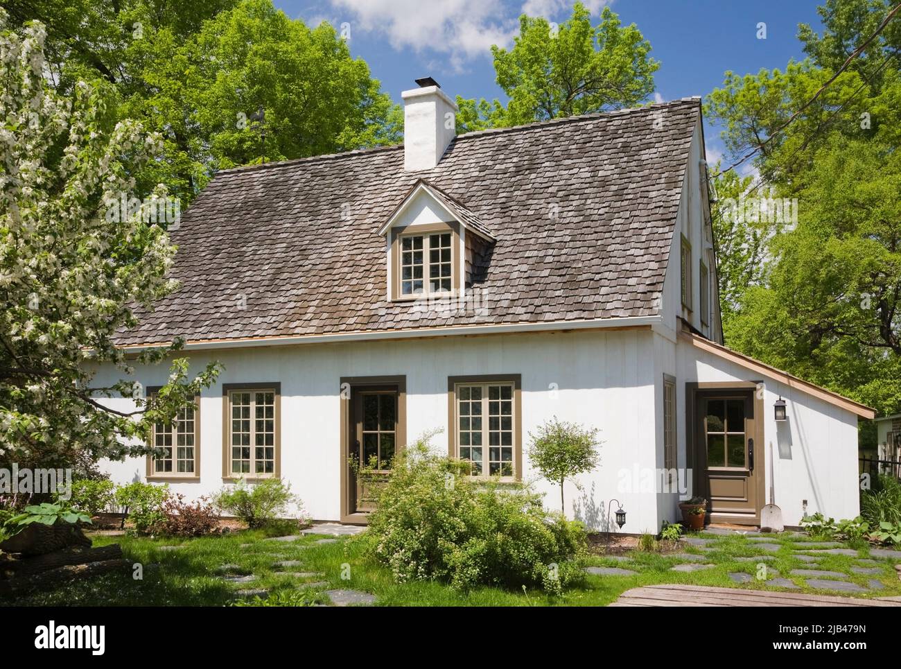 Old circa 1886 Canadiana cottage style home with white stucco cladding ...