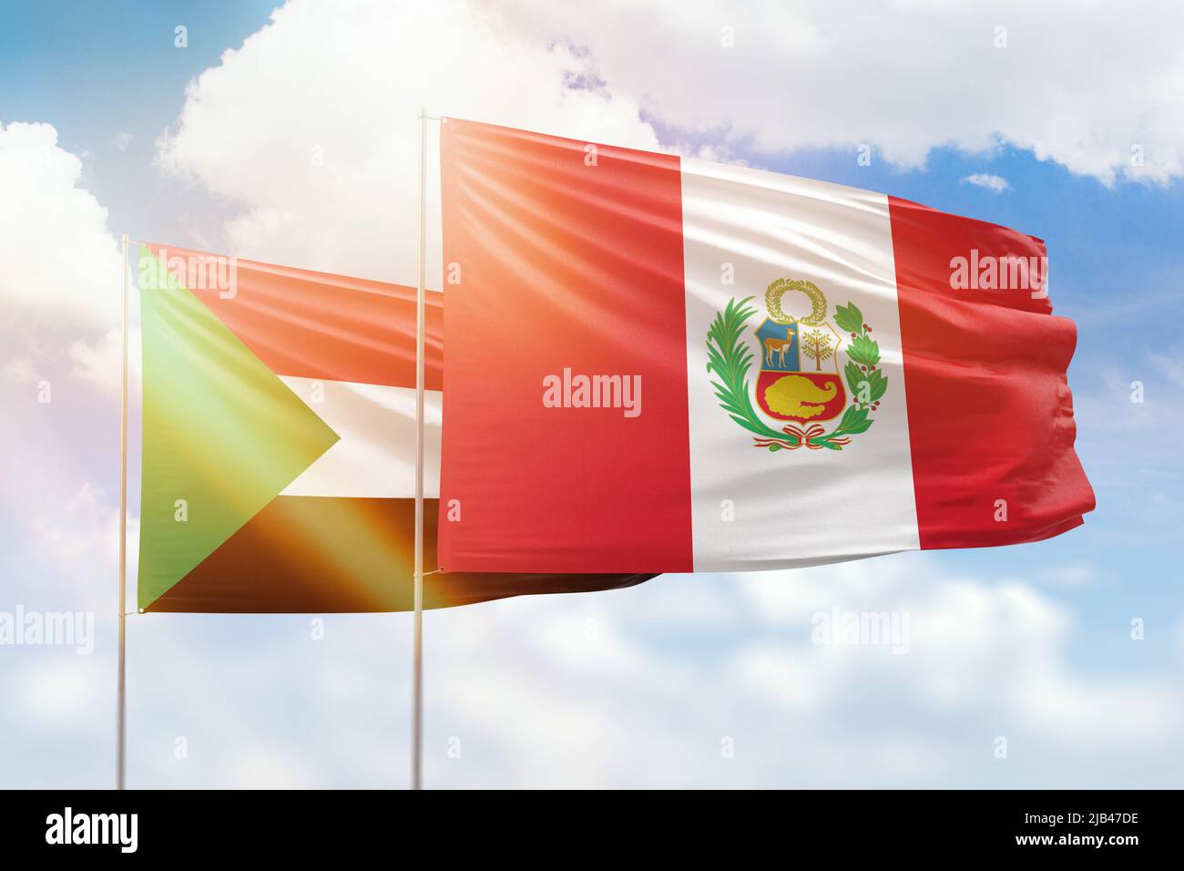Sunny blue sky and flags of peru and sudan Stock Photo - Alamy