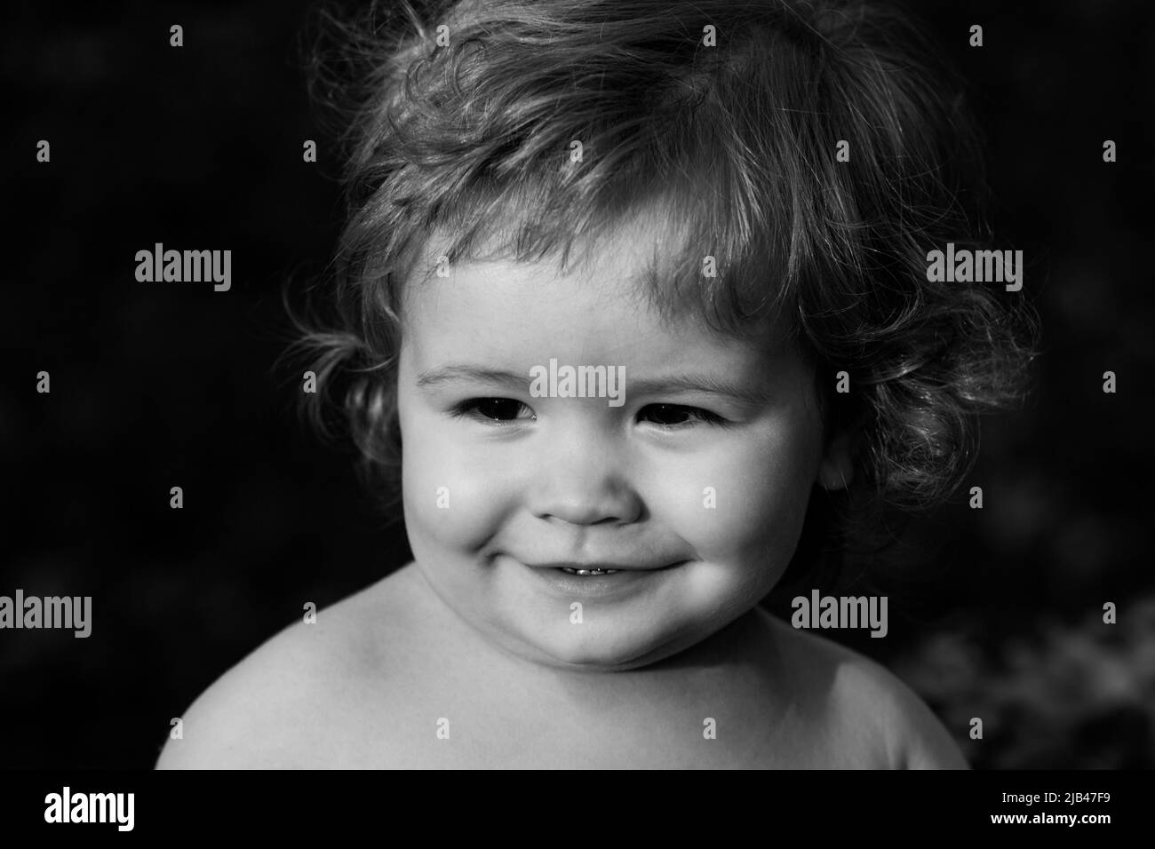 Close up portrait of a cute little baby on sunny day. Childhood and ...