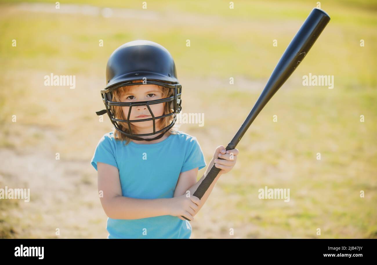 Kid baseball ready to bat. Child batter about to hit a pitch during a ...