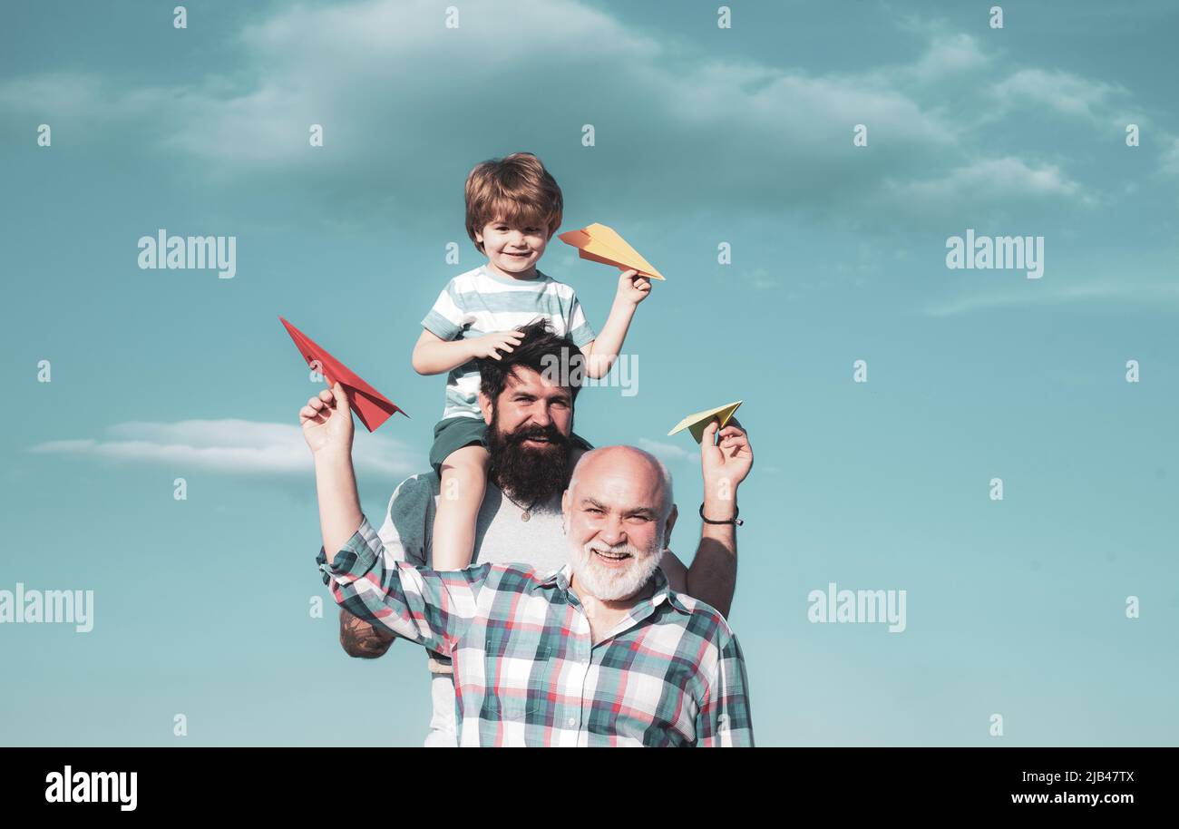 Freedom to dream - joyful kid playing with airplane against the sky ...