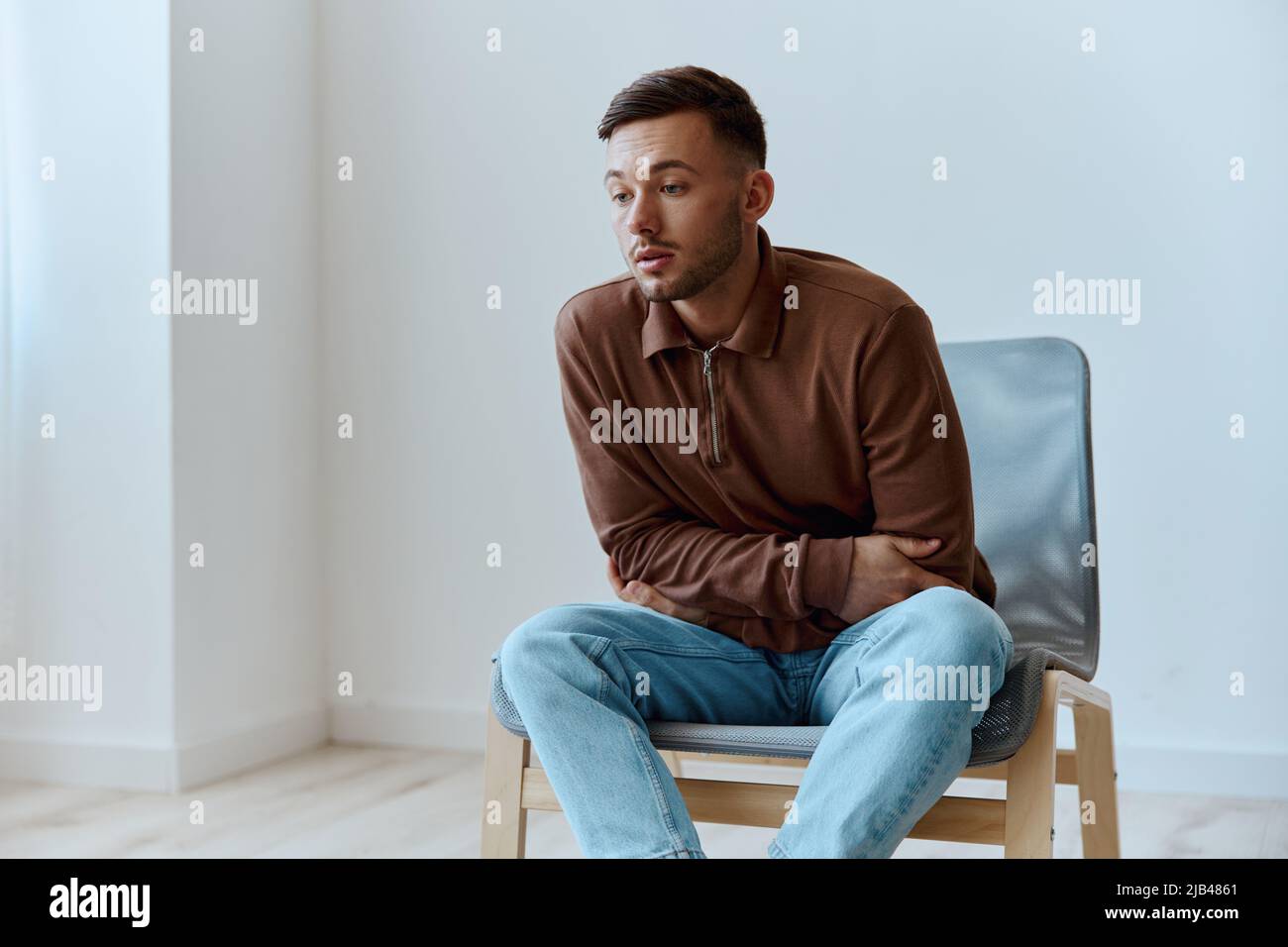 Pensive sad frustrated upset thoughtful young tanned man guy crosses ...