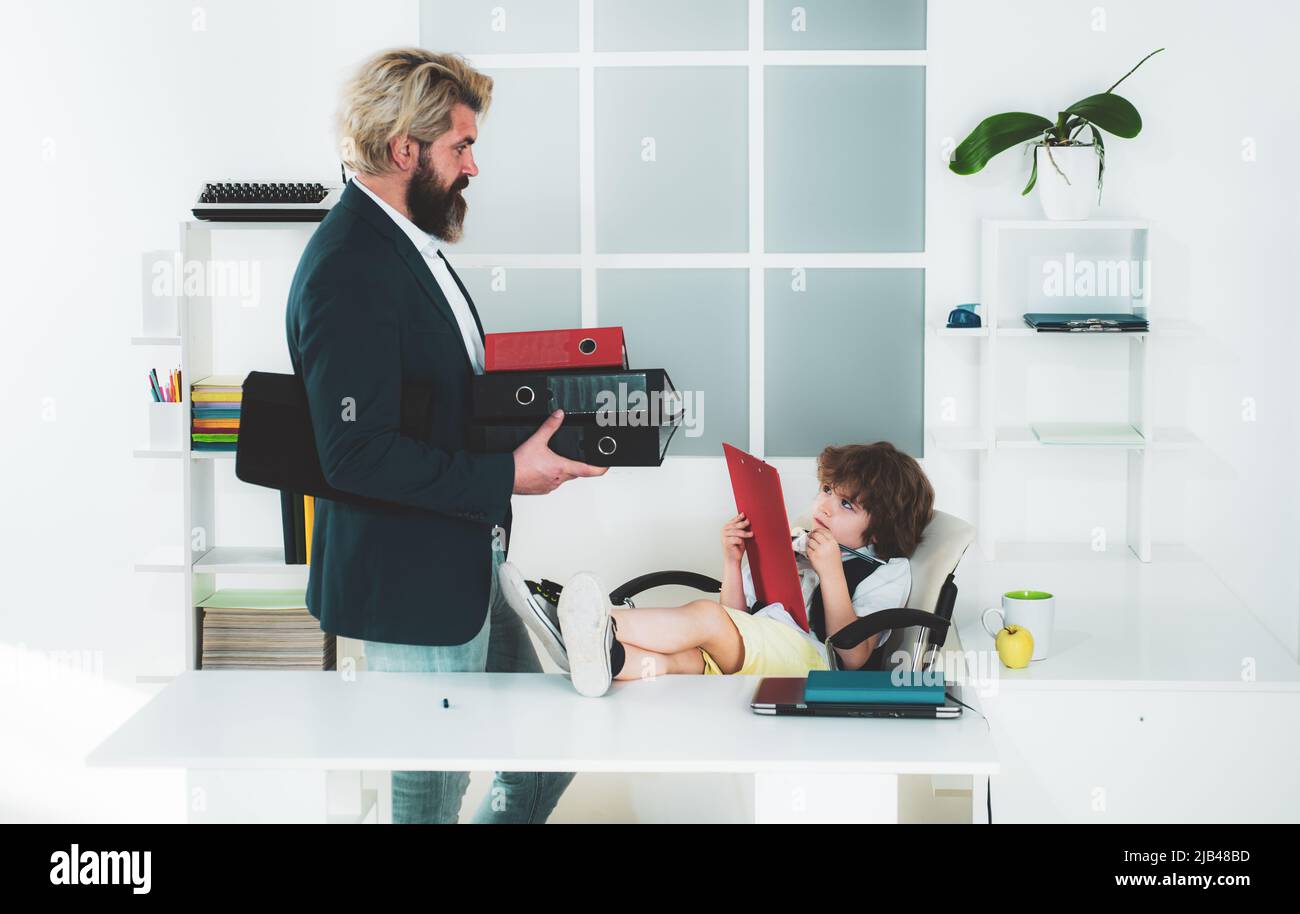 Boss and employee. Little boss and mature employee in the office. Old ...