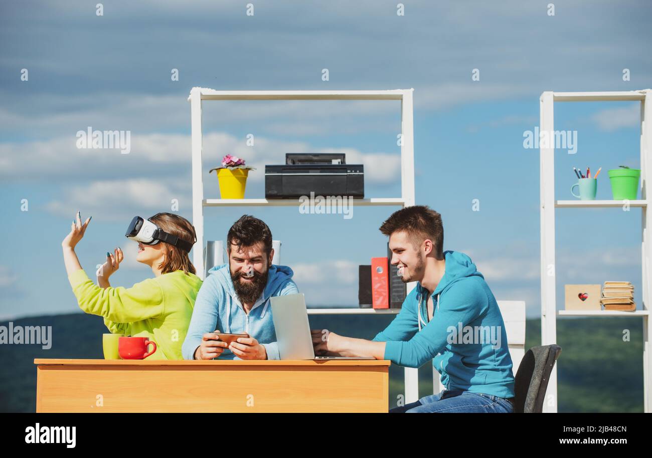 Team of young business people wearing vr headsets, working with new ...