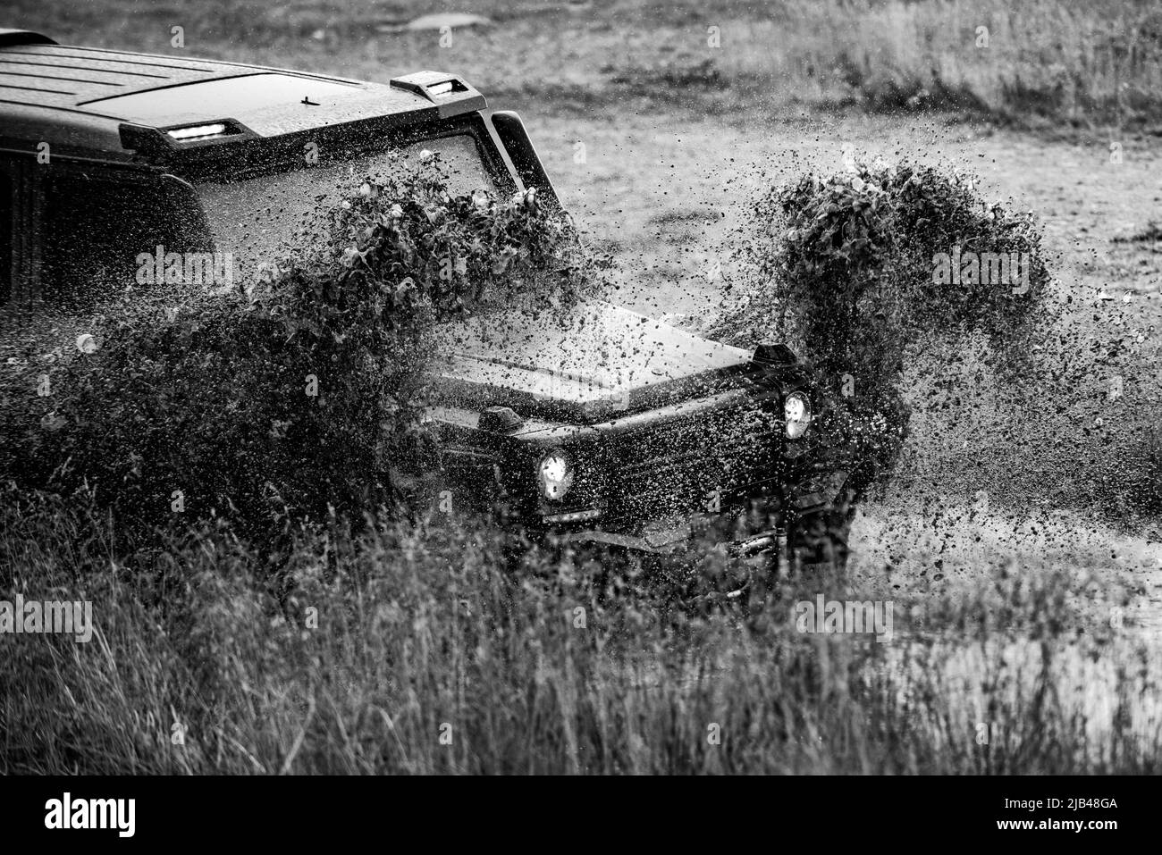 Off-road vehicle stuck on impenetrable road after rain in the ...