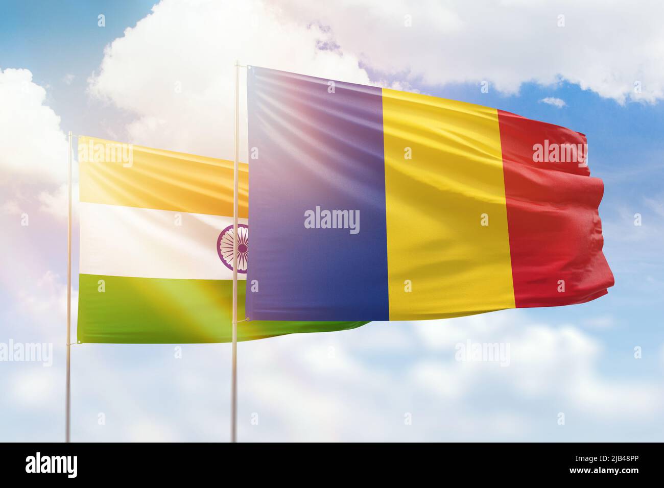 Sunny blue sky and flags of romania and india Stock Photo - Alamy