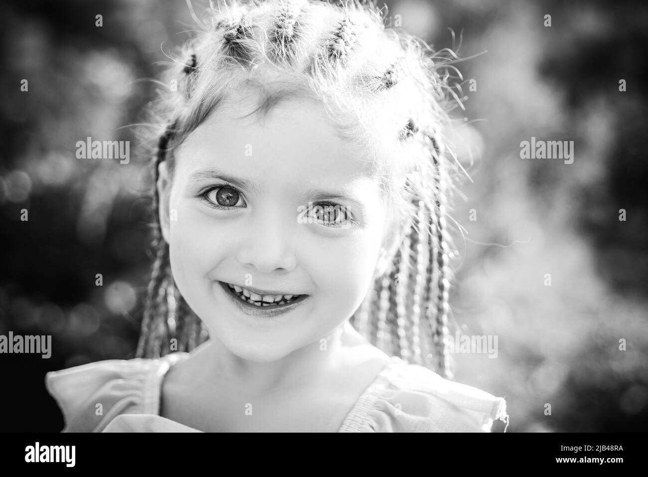 Child girl with stylish hair rope dreadlocks. Kid with fashionable ...