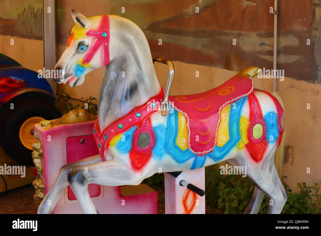 Coin operated amusement kiddie rides Stock Photo - Alamy