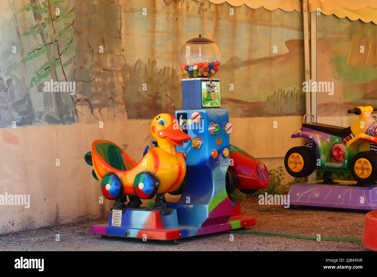 Coin operated amusement kiddie rides Stock Photo - Alamy