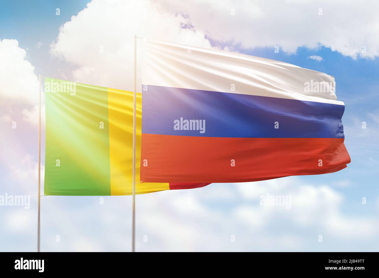 Sunny blue sky and flags of russia and mali Stock Photo - Alamy