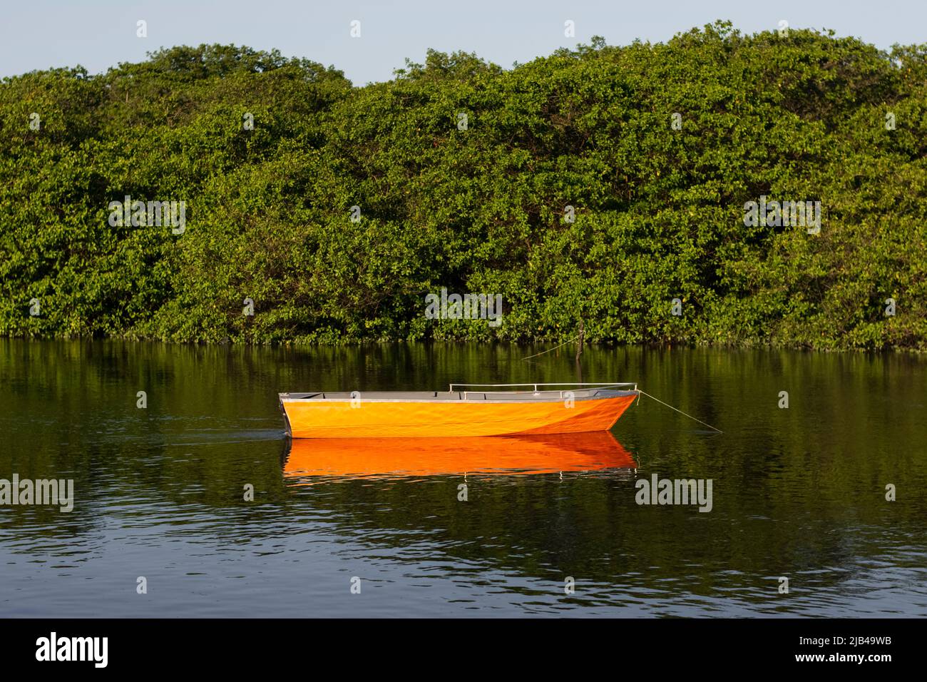 Canoes and boats docked on the Jaguaripe River in Maragogipinho ...