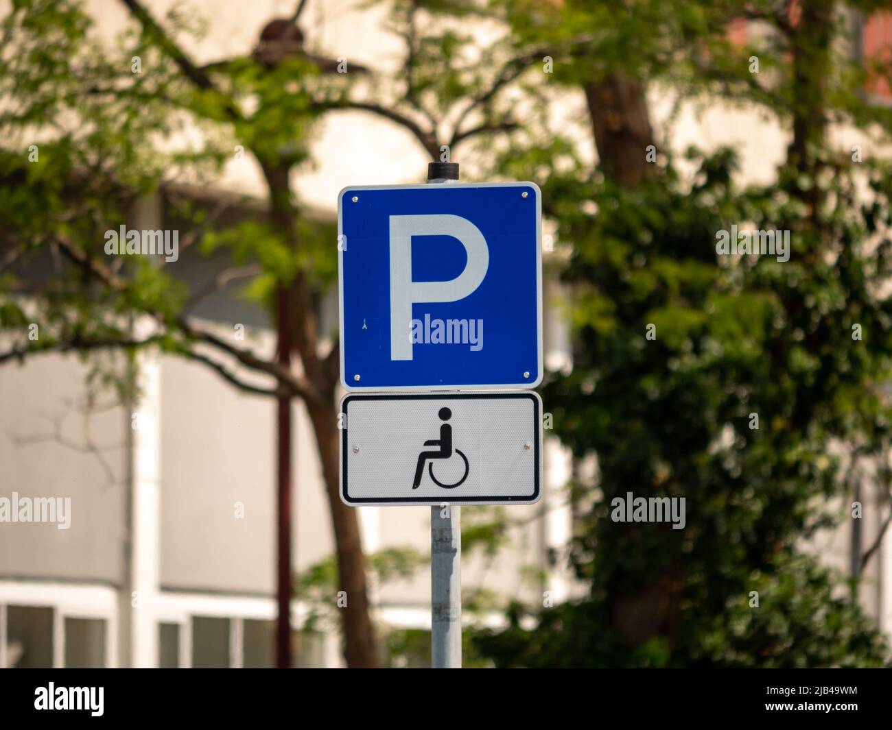 Accessible parking lot traffic sign. Street symbol with a wheelchair ...