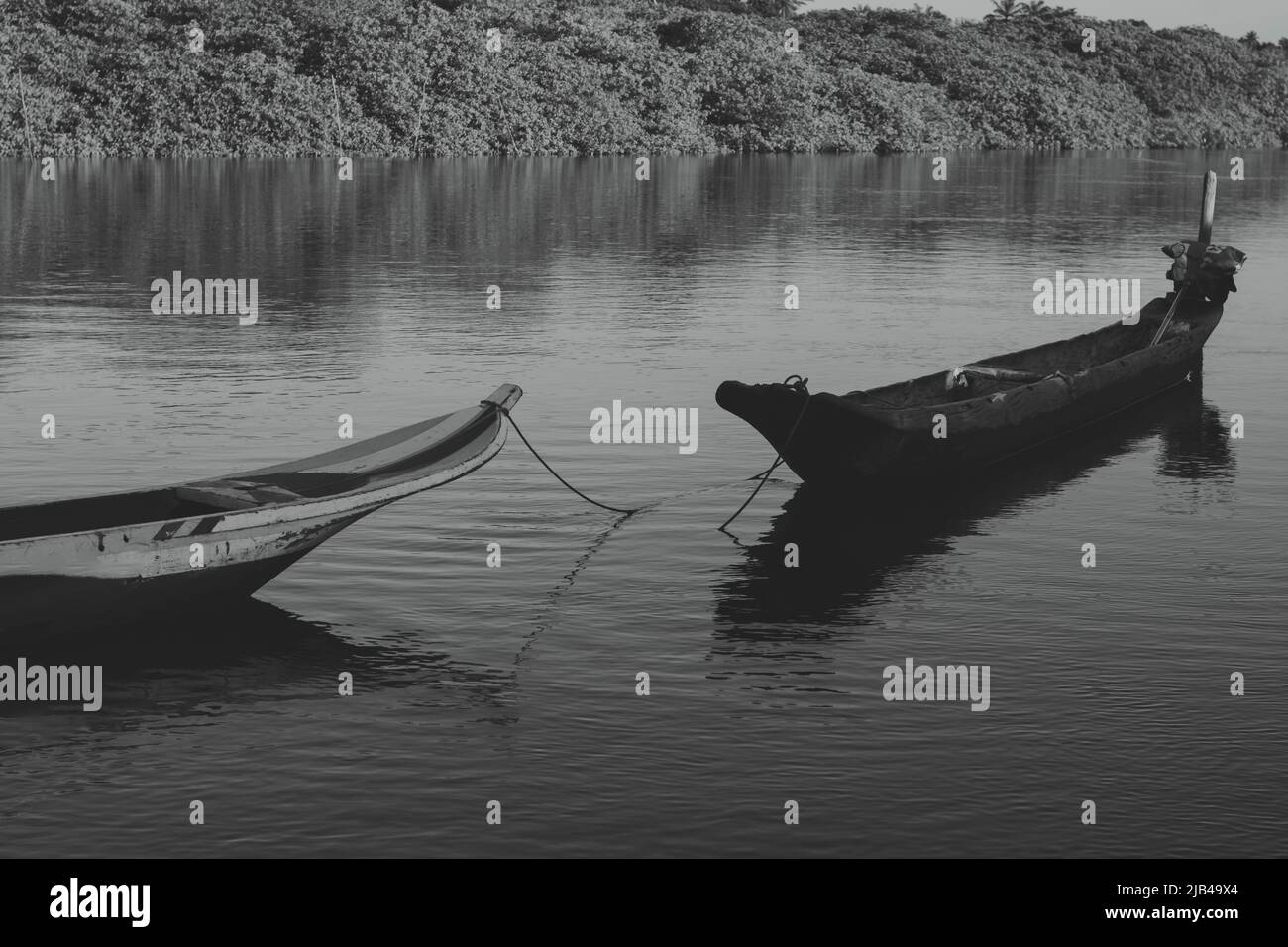 Canoes and boats docked on the Jaguaripe River in Maragogipinho ...