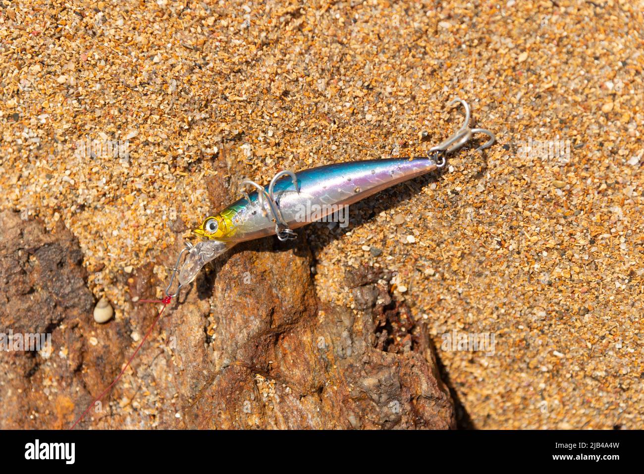Metal bait for fishing on the ground. Boca do Rio beach in Salvador ...