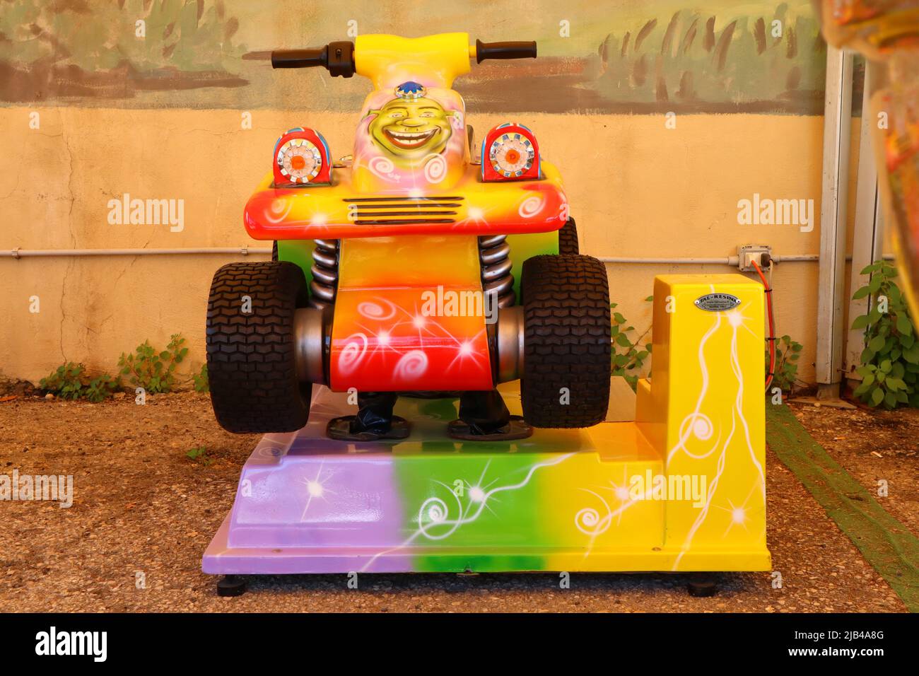 Coin operated amusement kiddie rides Stock Photo - Alamy
