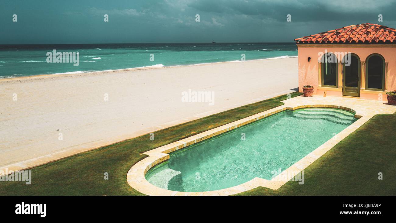 Palm and tropical beach. Terrace of a sea house overlooking the beach ...