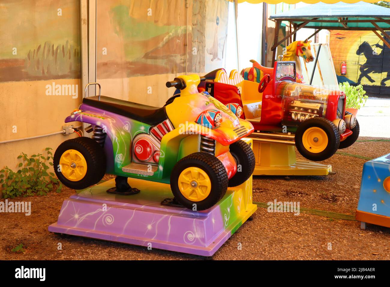 Coin operated amusement kiddie rides Stock Photo - Alamy