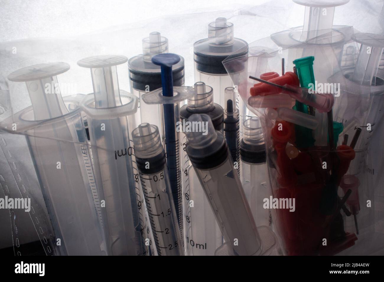 Medical syringe kit (needle, cap, syringe) in a transparent pack ...