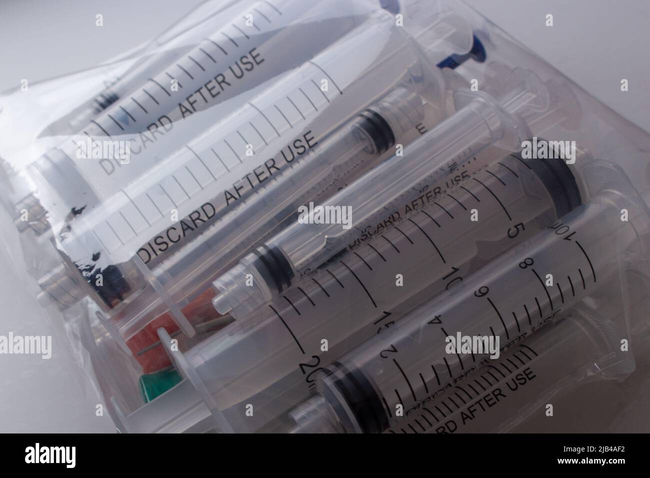 Medical syringe kit (needle, cap, syringe) in a transparent pack ...