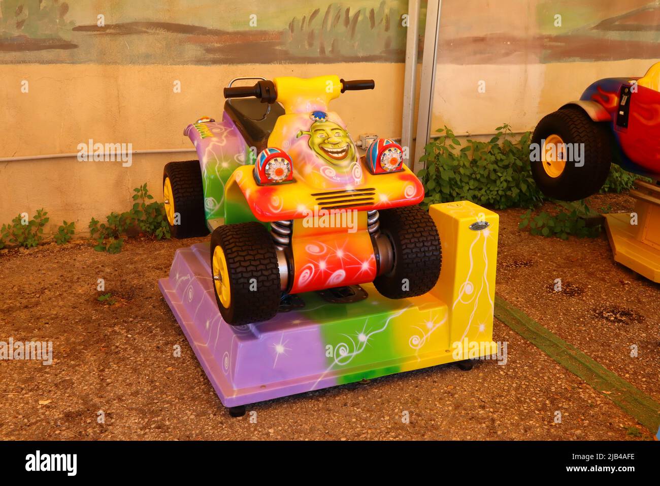 Coin operated amusement kiddie rides Stock Photo - Alamy
