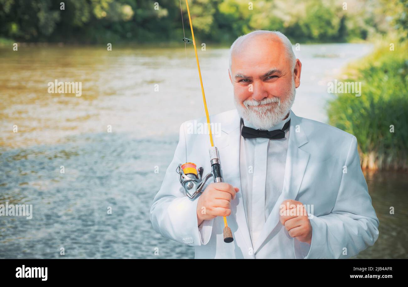 Fly fishing for trout. Brown trout being caught in fishing net ...
