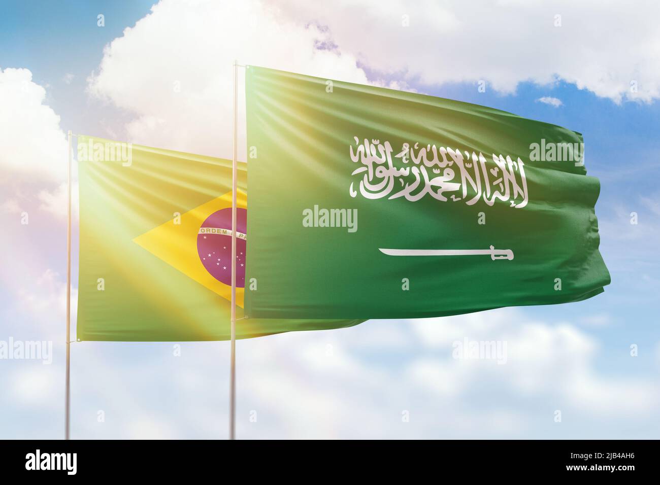 Sunny blue sky and flags of saudi arabia and brazil Stock Photo - Alamy