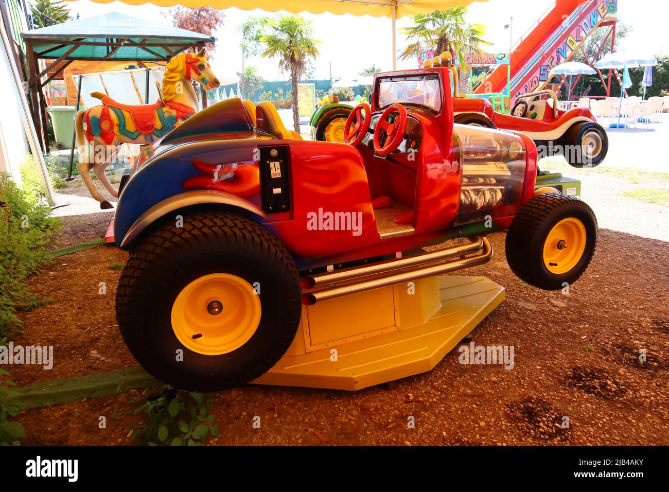 Coin operated amusement kiddie rides Stock Photo - Alamy