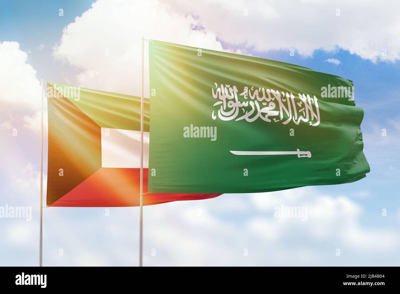 Sunny blue sky and flags of saudi arabia and kuwait Stock Photo - Alamy