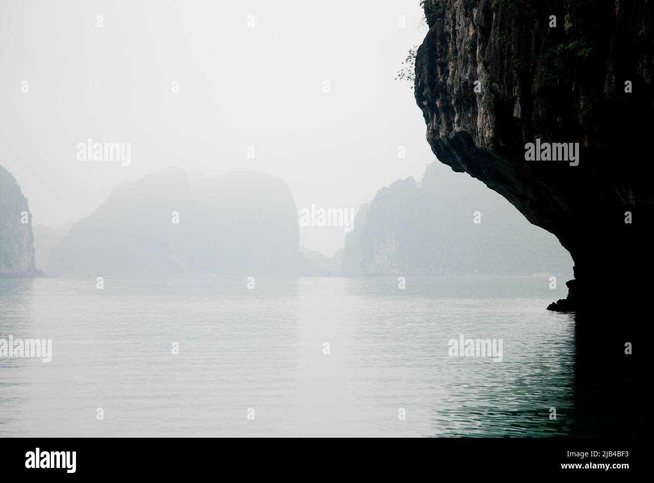 Reflective rocks in Ha Long Bay near Cat Ba island, Vietnam Stock Photo ...