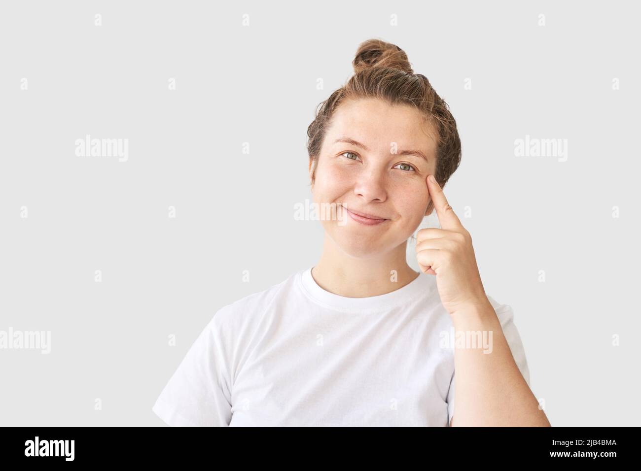 Young woman posing at grey background. Home vacation portrait. Blogger ...